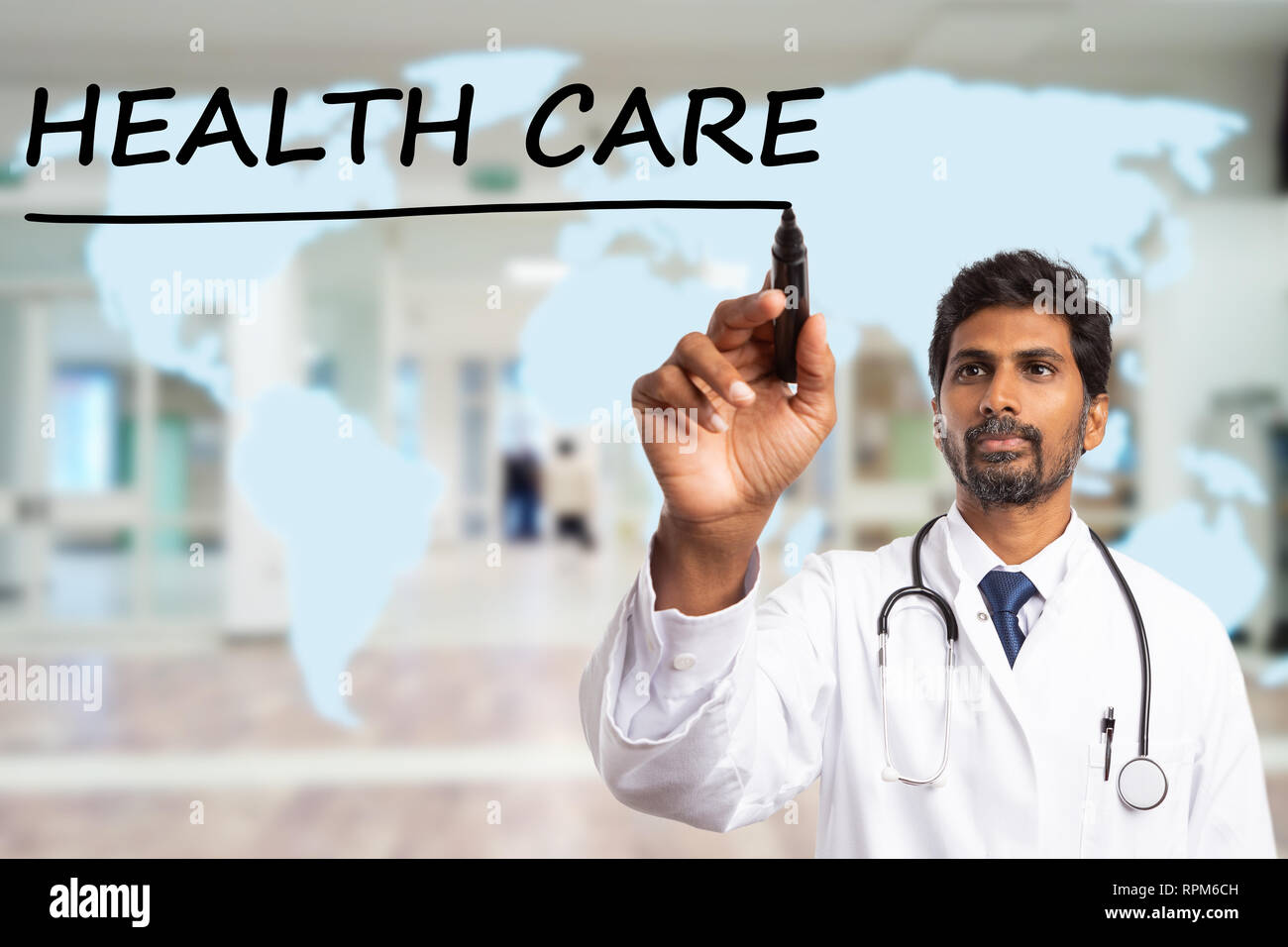 Indian medic man drawing black marker line under health care text on ...