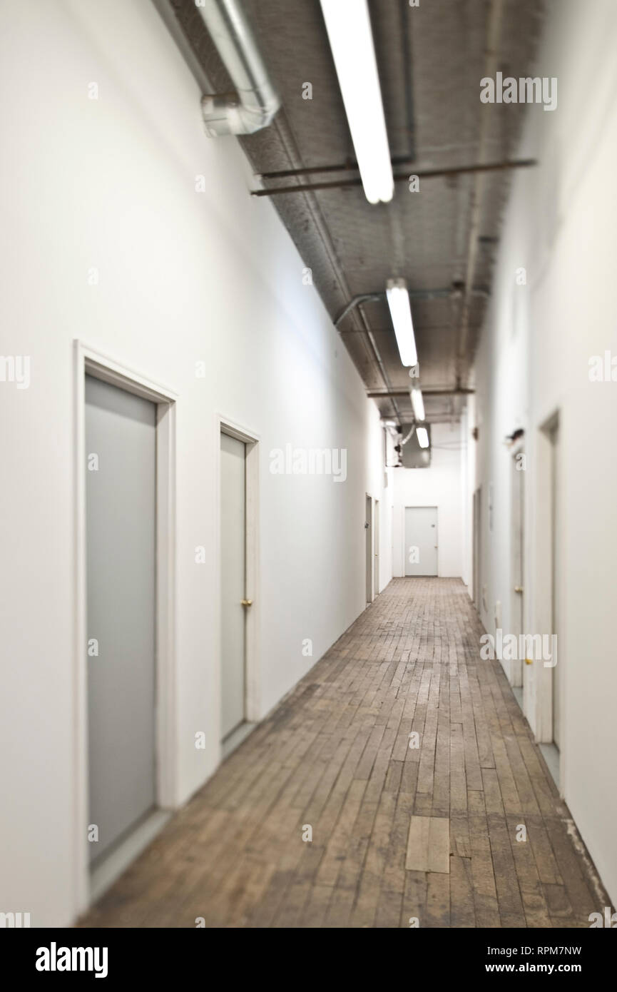 Long Corridor With Closed Doors Stock Photo - Alamy