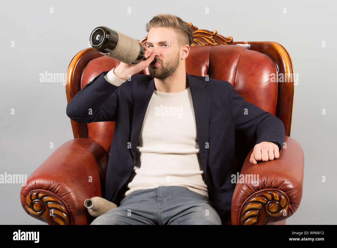 Businessman formal suit sit leather chair, grey background. Man serious ...