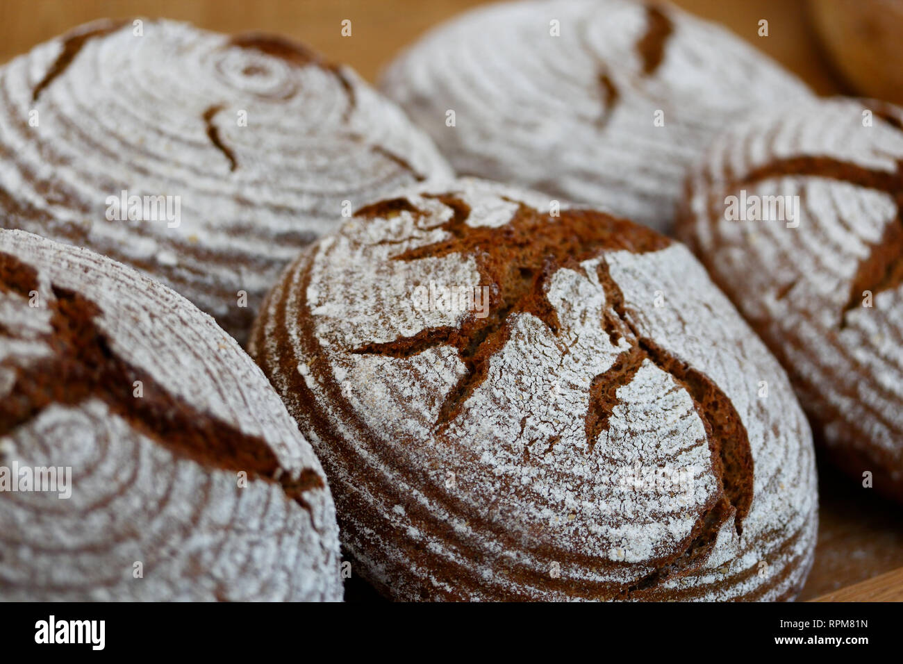 Round loaves of traditional dark rye bread. Selective focus Stock Photo ...
