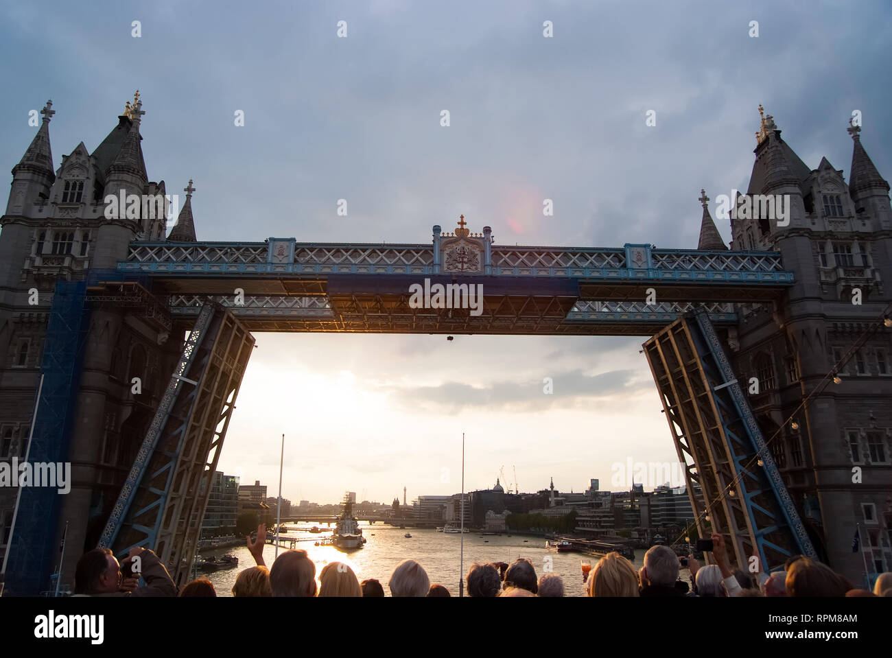 Tower bridge getting opened in London, United Kingdom. People look at ...