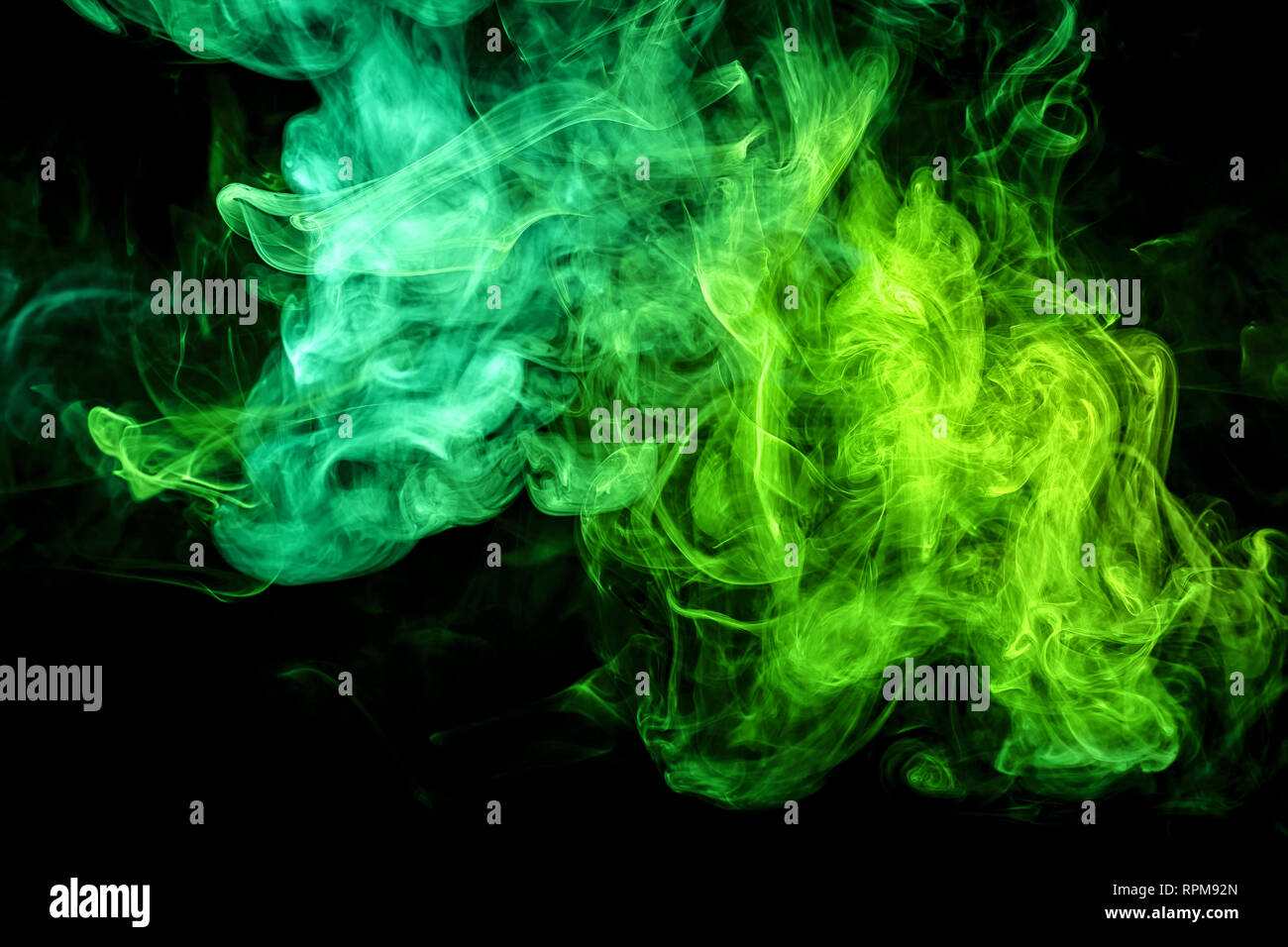 Close up swirling green smoke on black isolated background Stock Photo ...