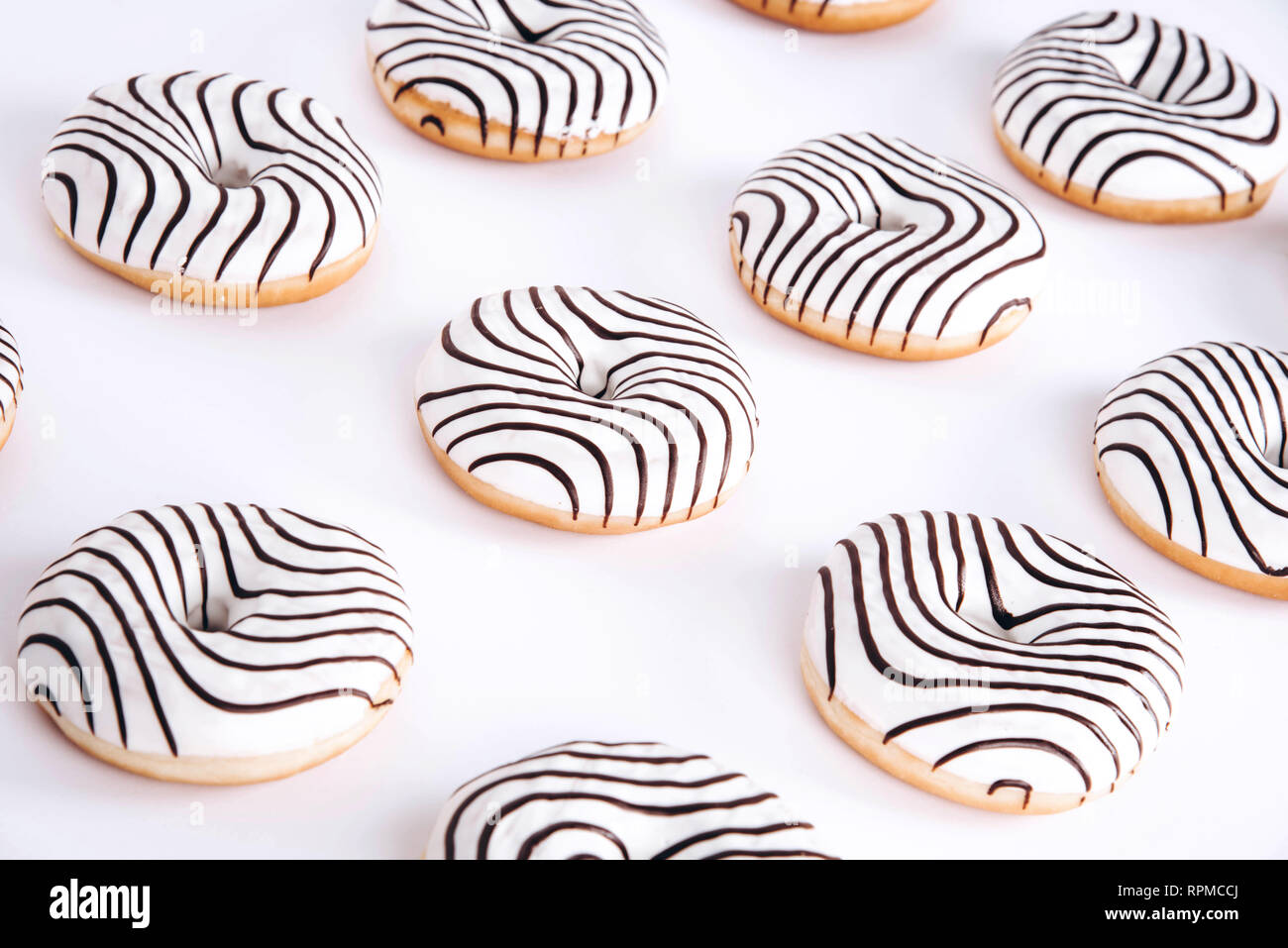 Striped donuts on a white background. Stylish minimal concept Stock ...