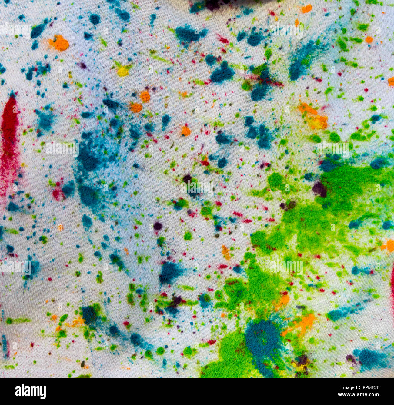 Multicolored dry paint on the cloth Stock Photo - Alamy