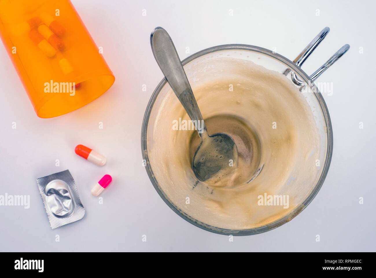 Medication during breakfast, capsules next to a glass of coffee ...