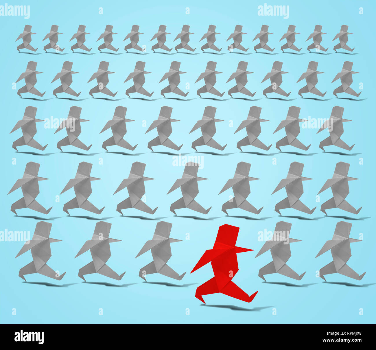 Walking paper Man in origami with a red one on blue background ...