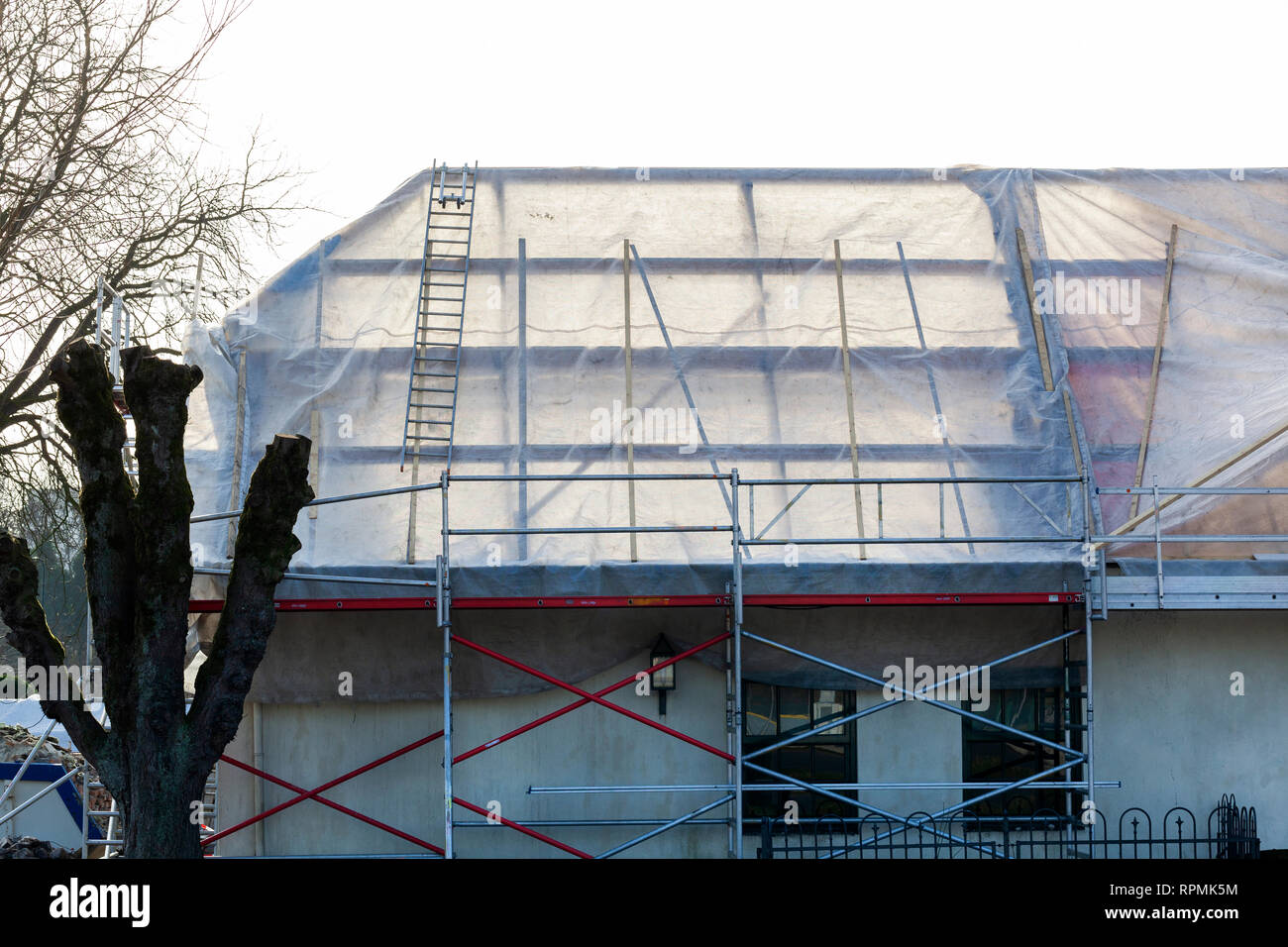 Roof covered with plastic sheeting because of a complete roof ...