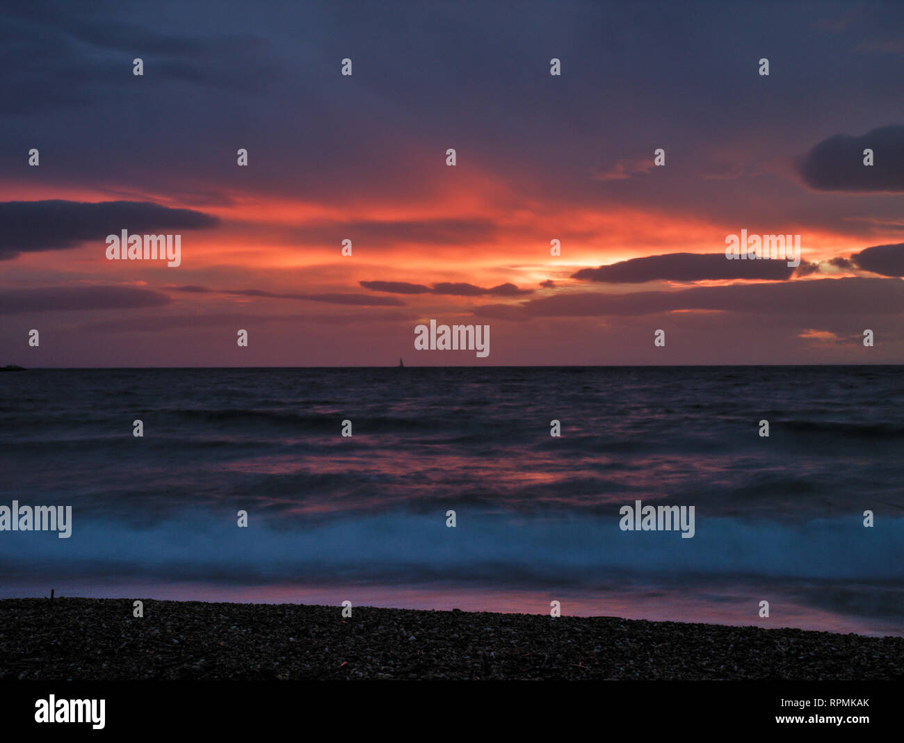 Beautiful colorful sky sunset on the beach at winter time. Attica ...