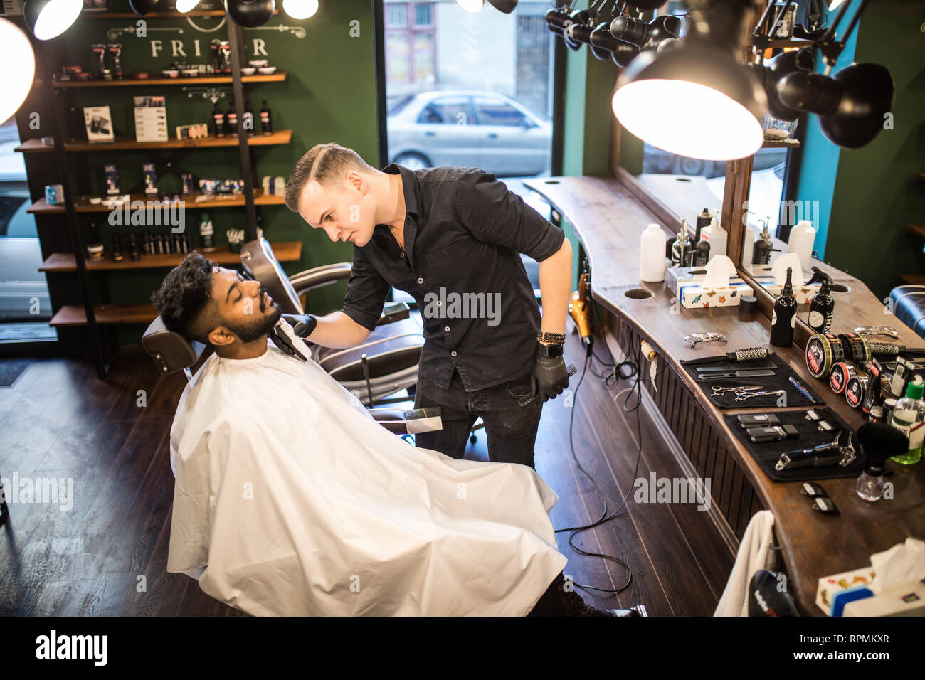 Close up Man with beard client in barbershop hairdresser Barber on ...