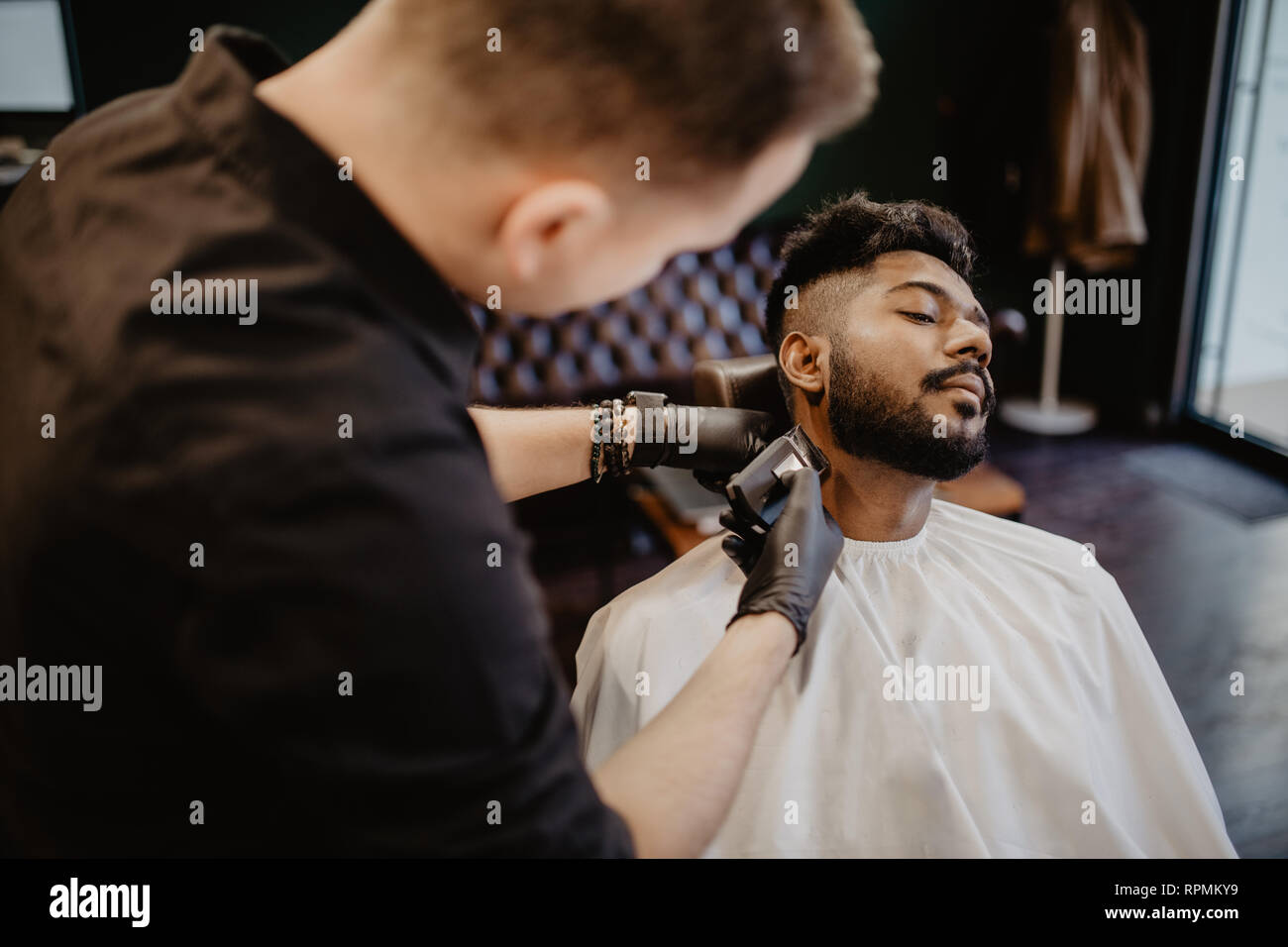 Woman barber shaving man in hi-res stock photography and images - Alamy