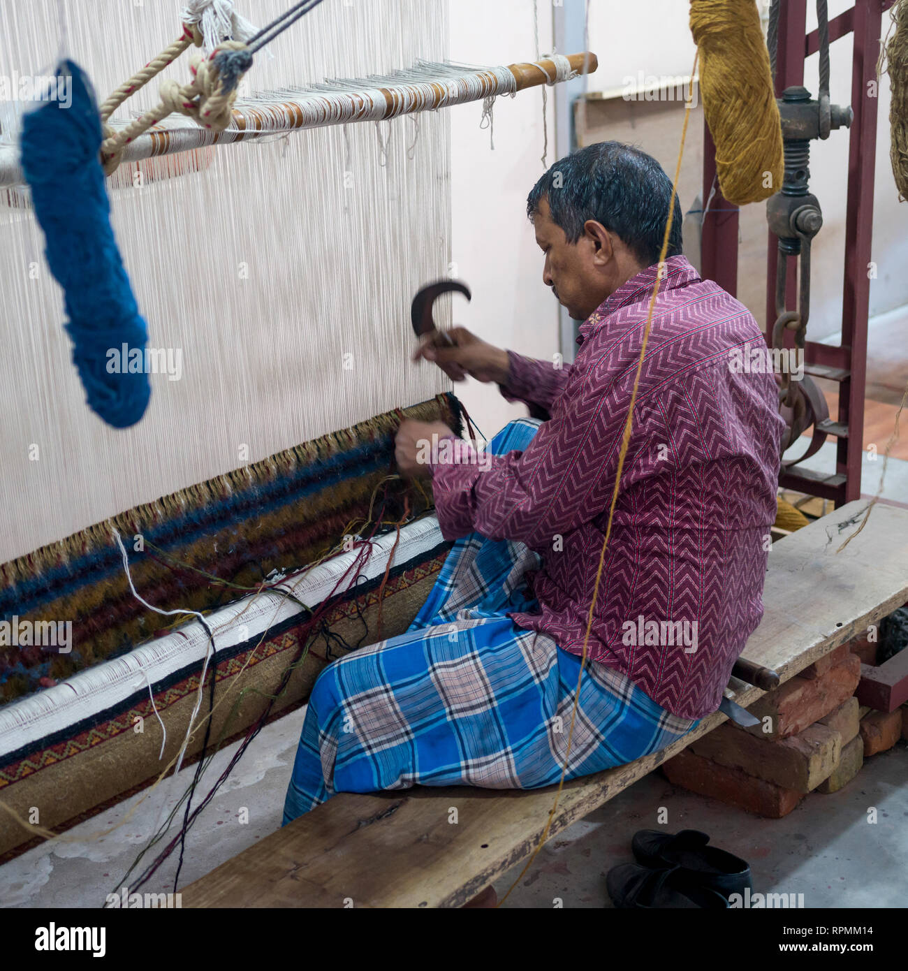 Man weaving carpet in a handloom, Jaipur, Rajasthan, India Stock Photo ...