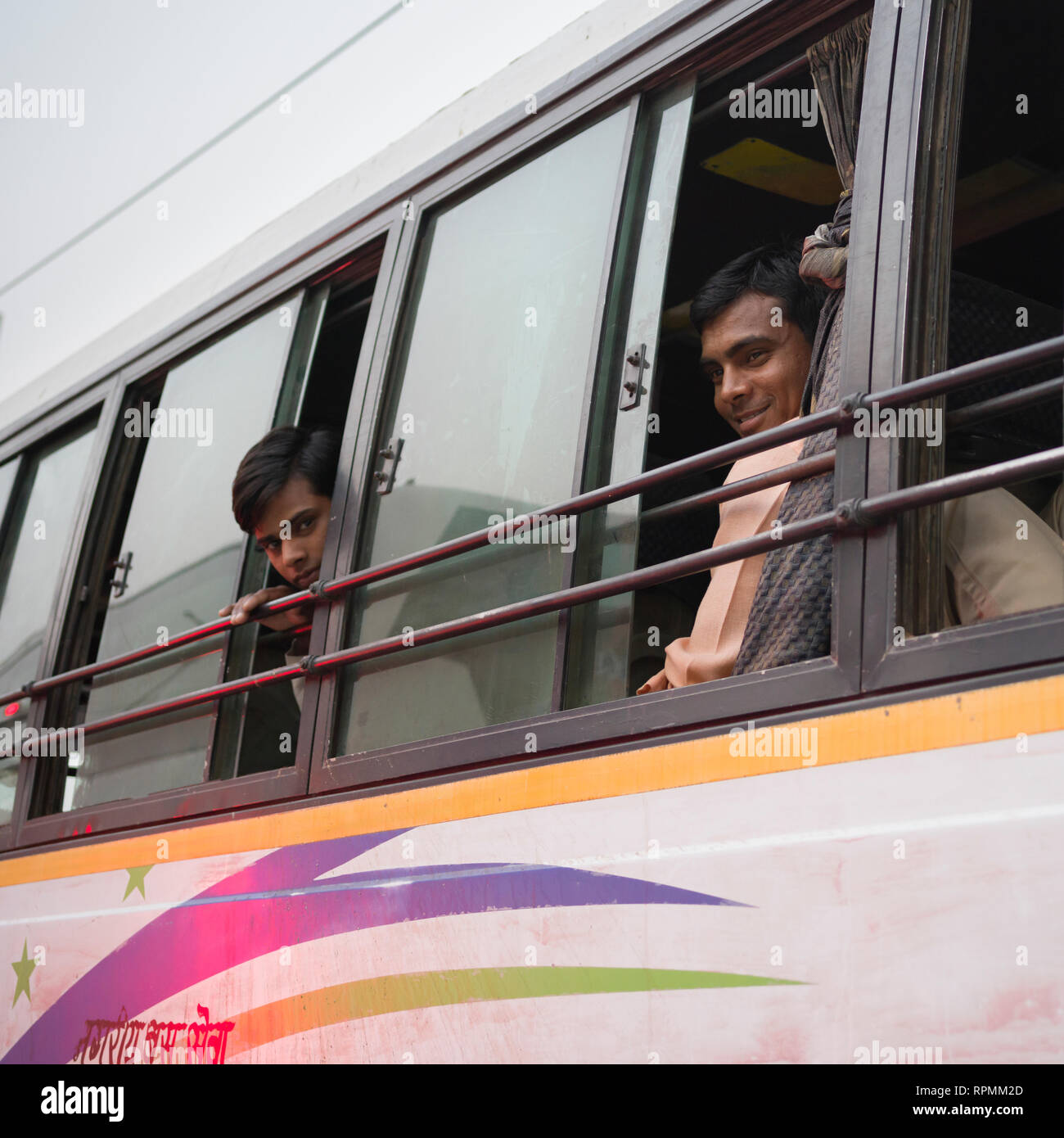 Passengers sitting in bus looking through window, Jaipur, Rajasthan ...