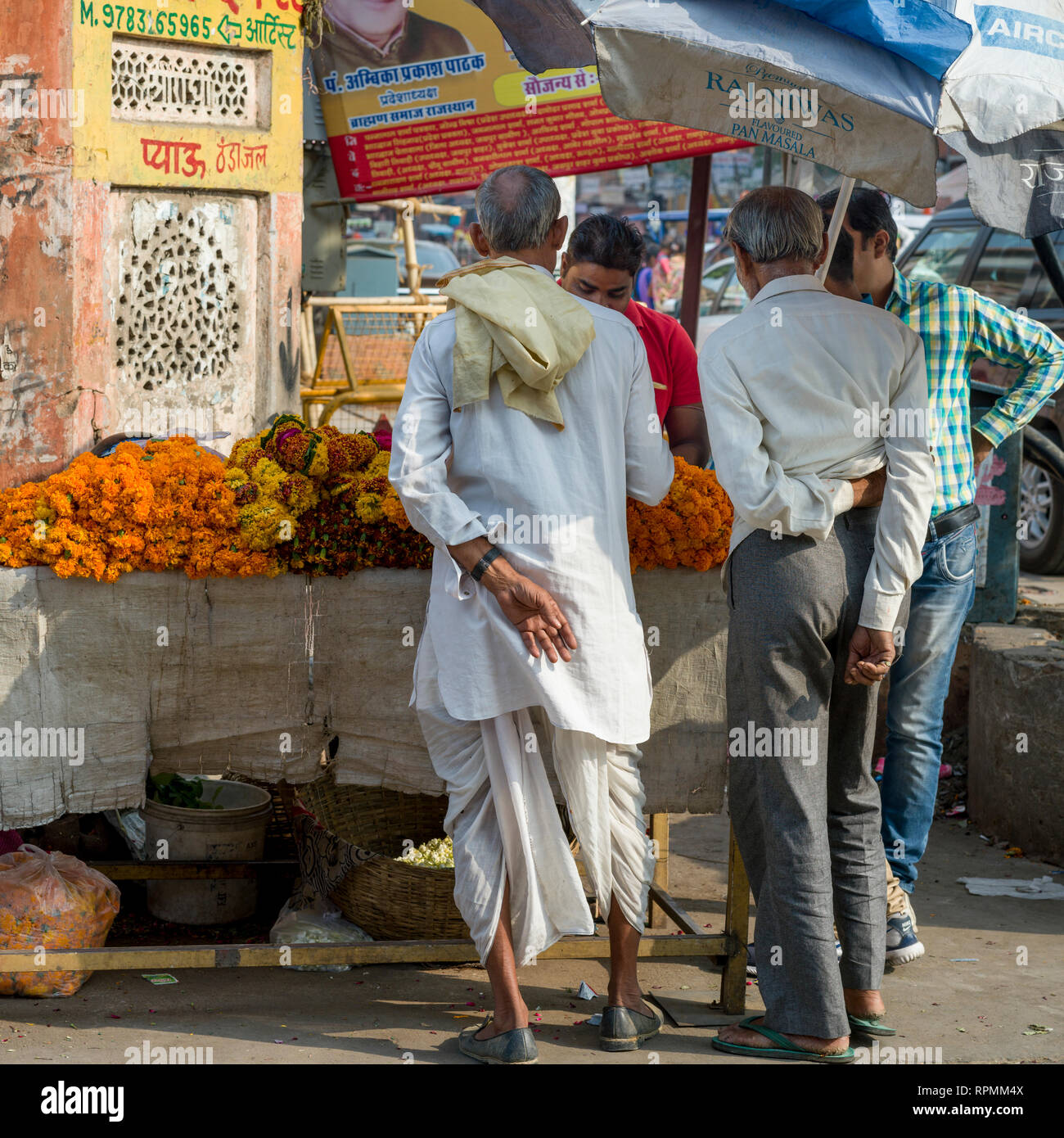 Man selling garlands near temple, Jaipur, Rajasthan, India Stock Photo ...