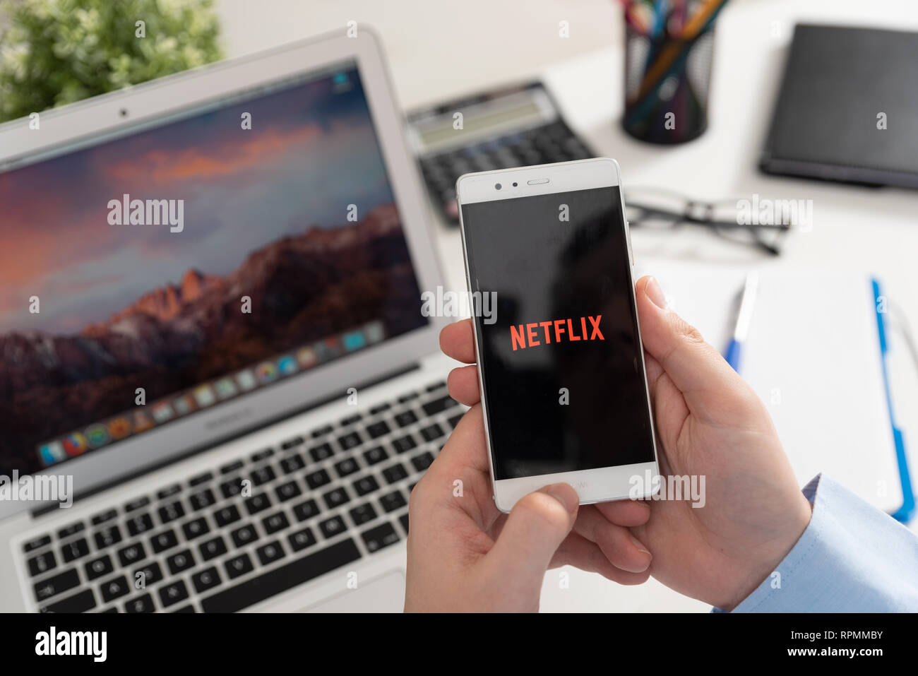Wroclaw, Poland - JAN 31, 2019: Man holding smartphone with Netflix ...