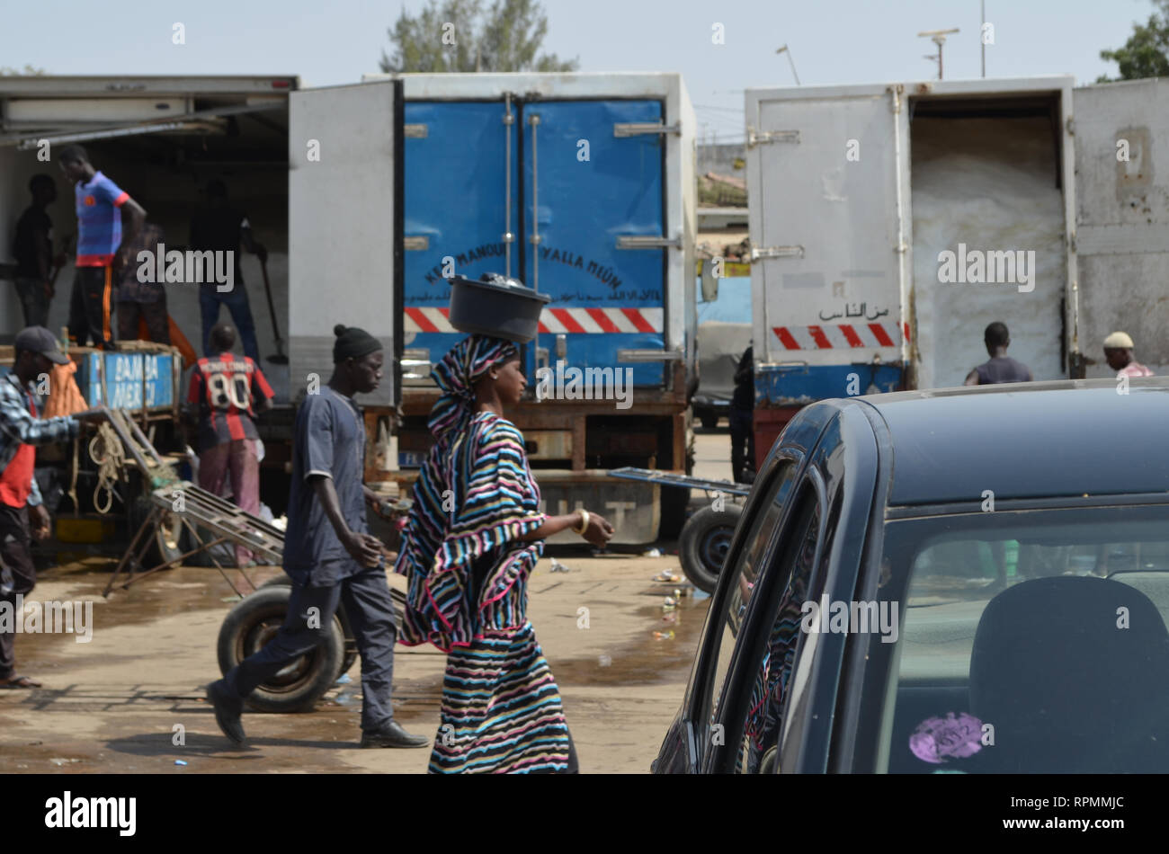 Trucks at the parking lot of Mbour fish market Stock Photo - Alamy