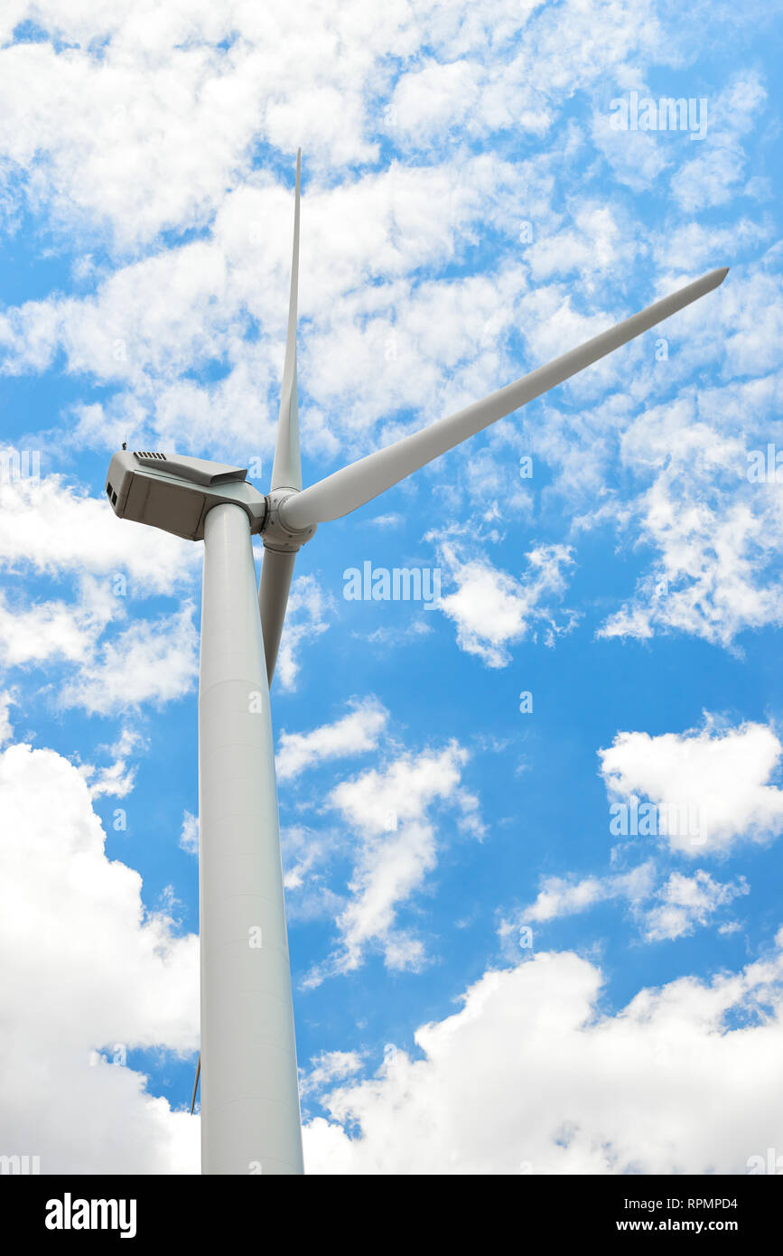 wind generator is on bright cloudy sky background. Power and energy ...