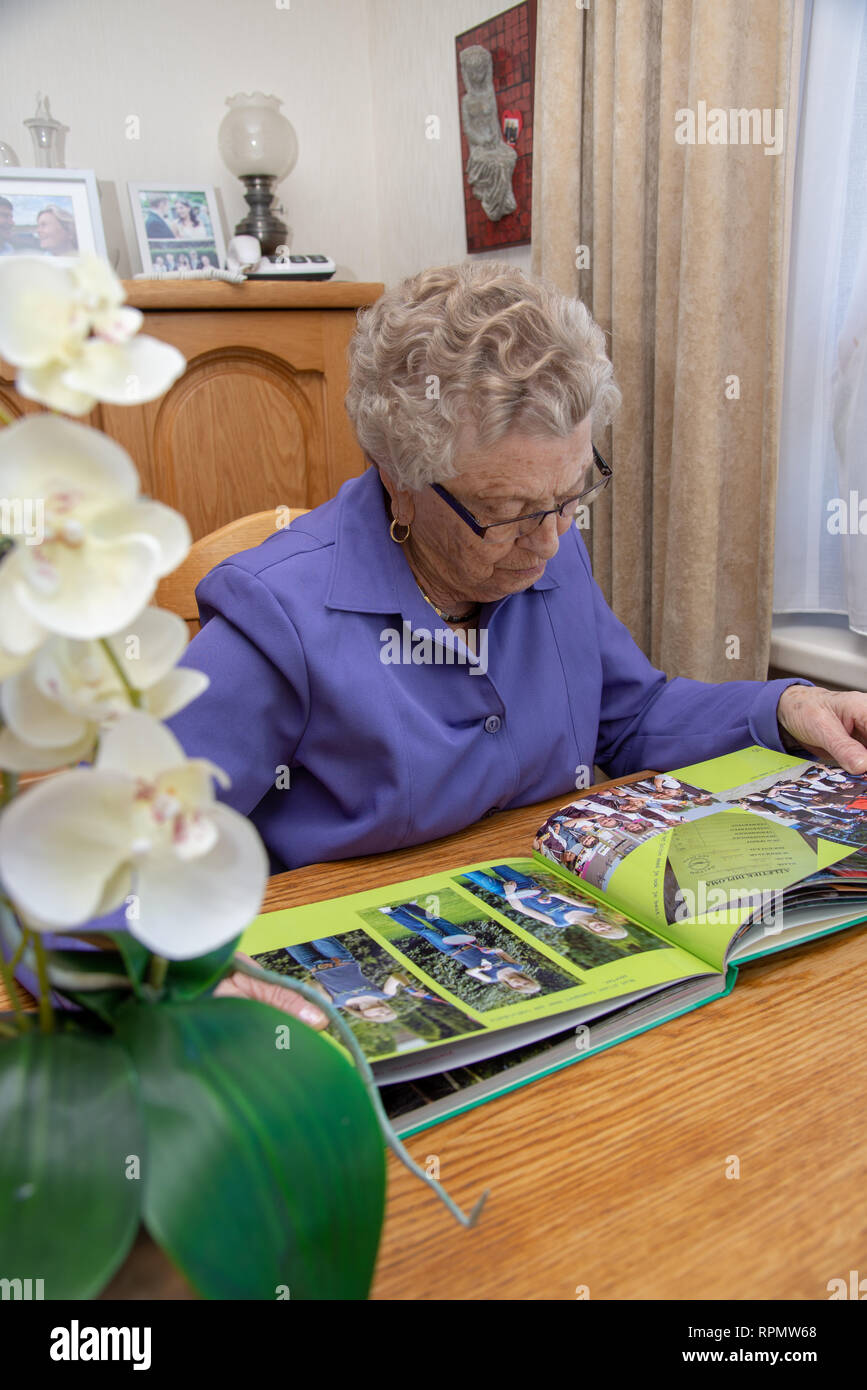 old woman reading book Stock Photo - Alamy