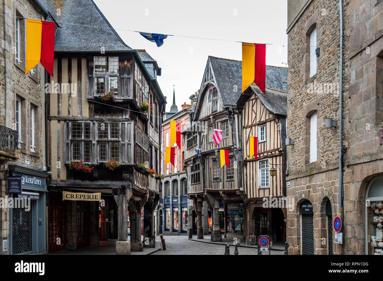 Dinan, France - July 24, 2018: Old cobblestoned street with timber ...