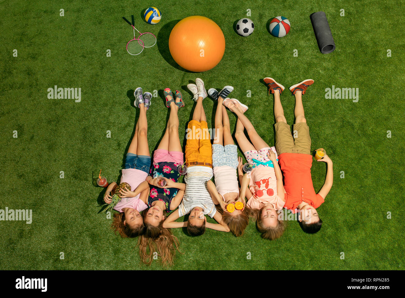 Group of happy children playing outdoors. Kids having fun in spring ...