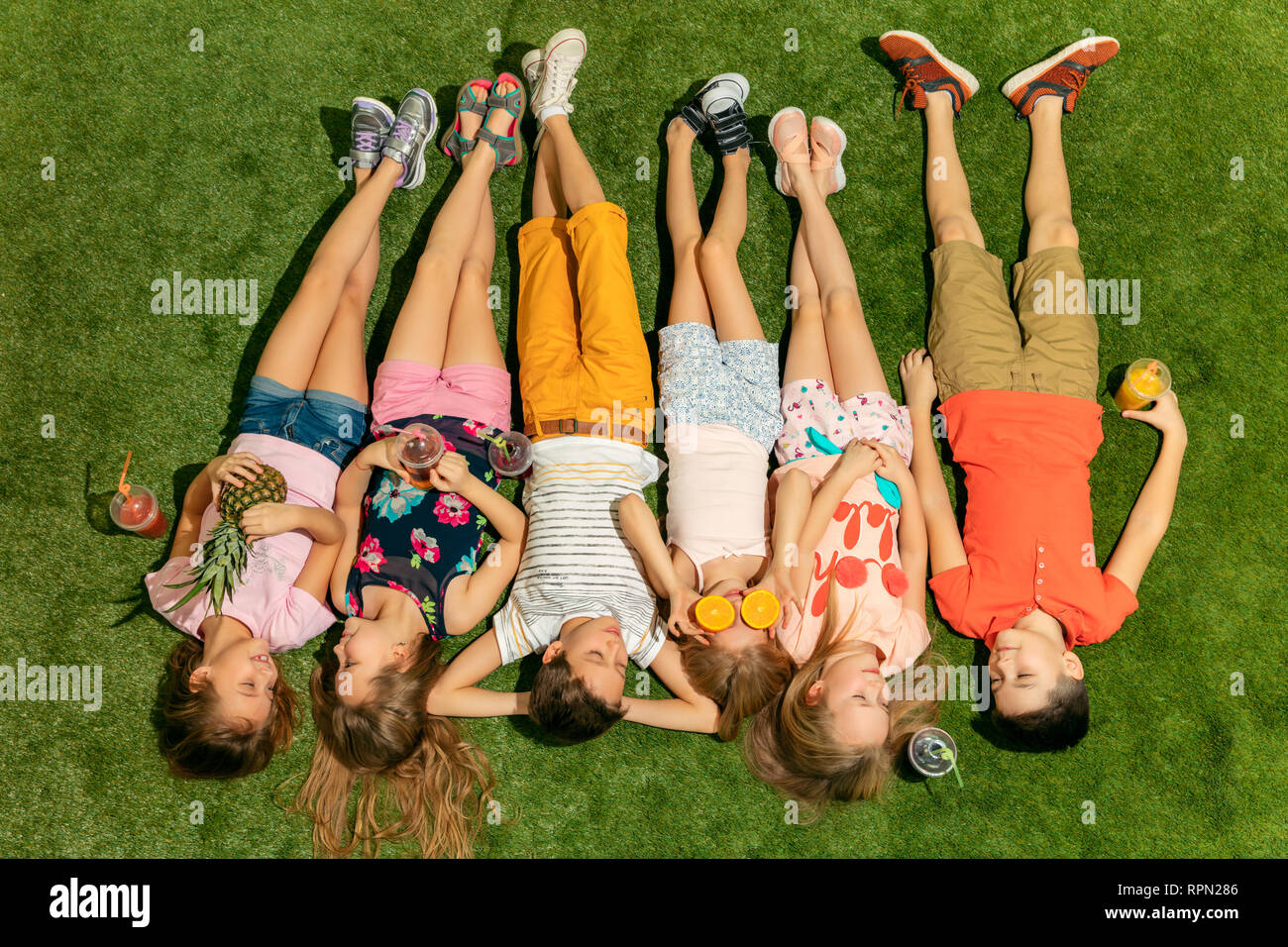 Group of happy children playing outdoors. Kids having fun in spring ...
