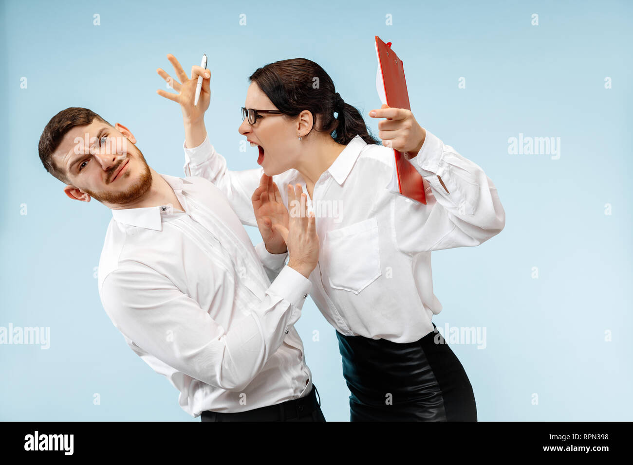 Angry boss. Woman and his secretary standing at office or studio ...