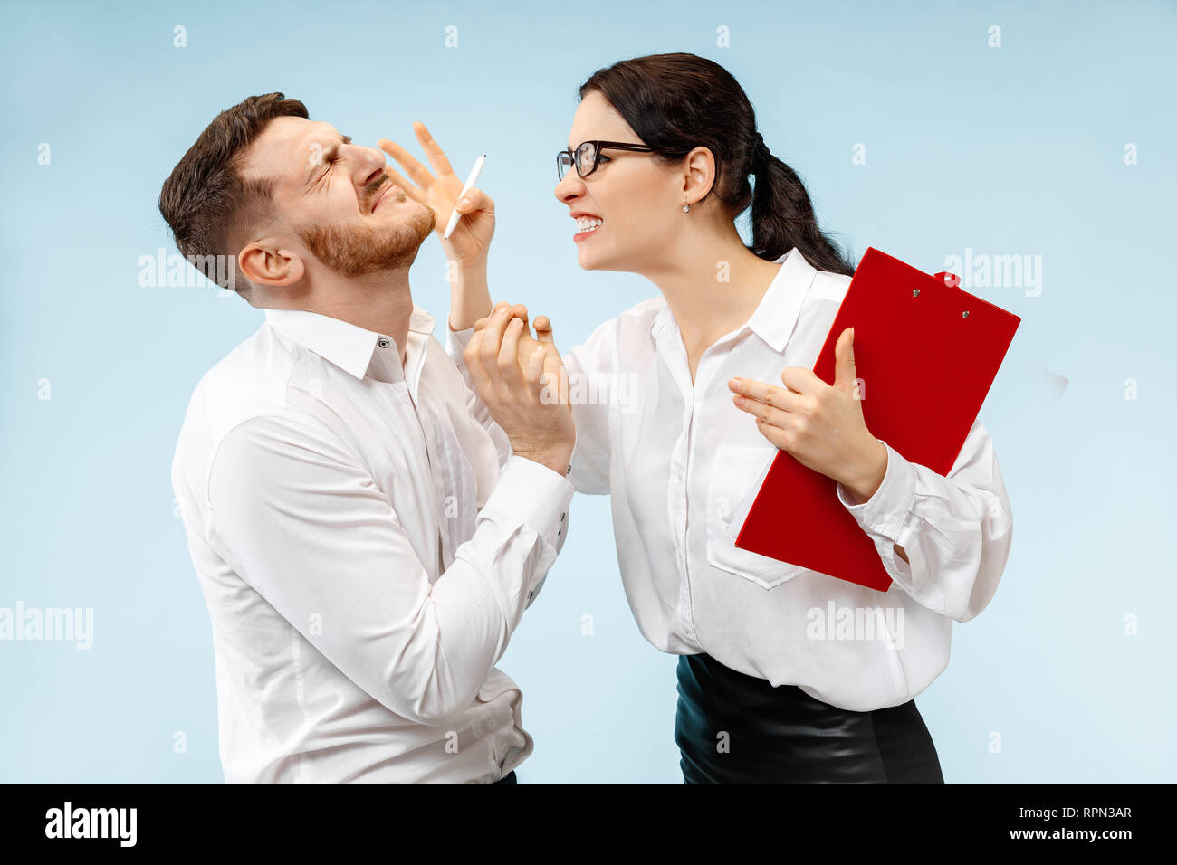 Angry boss. Woman and his secretary standing at office or studio ...