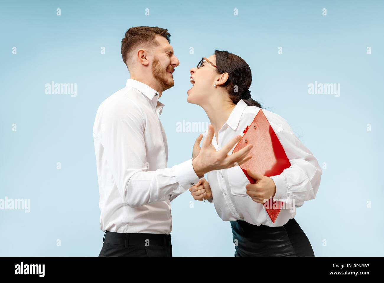 Angry boss. Woman and his secretary standing at office or studio ...