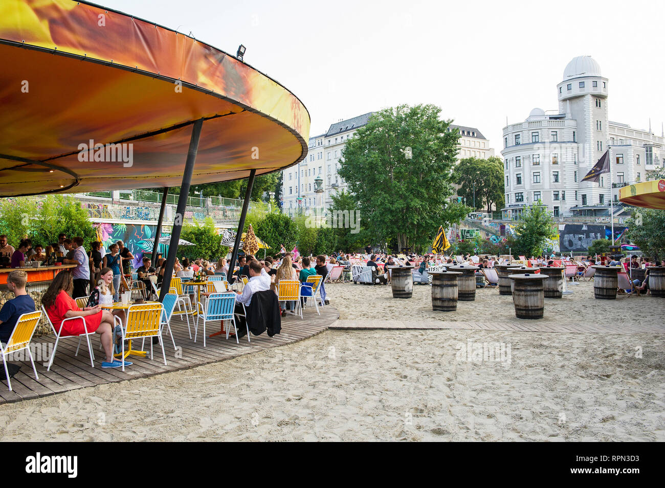 People chilling at Strandbar Herrmann, Vienna's urban beach, open from ...