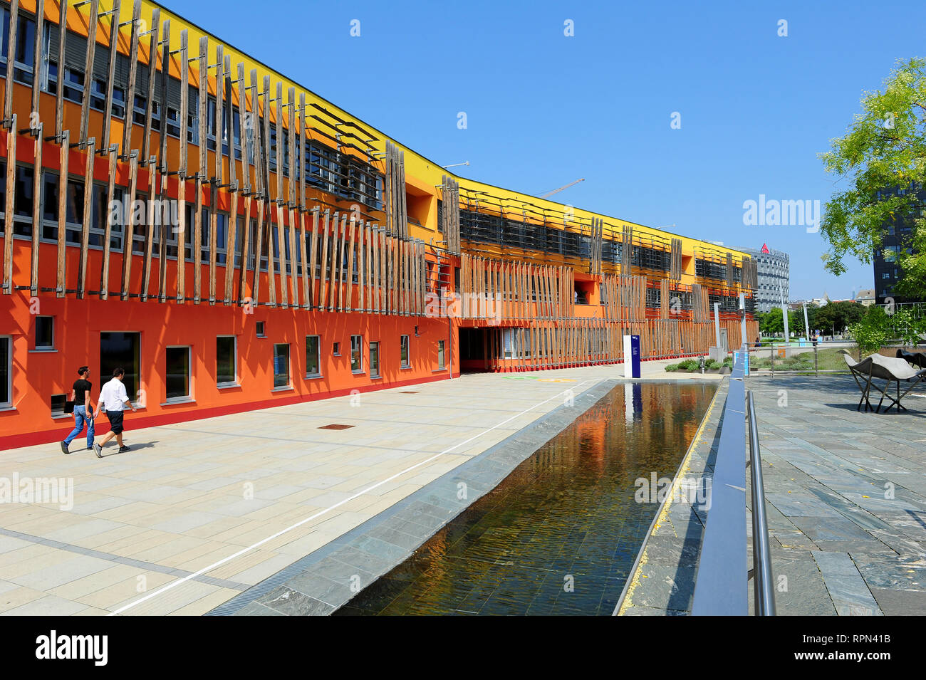 Two people walking along the new Campus WU, Vienna University of ...
