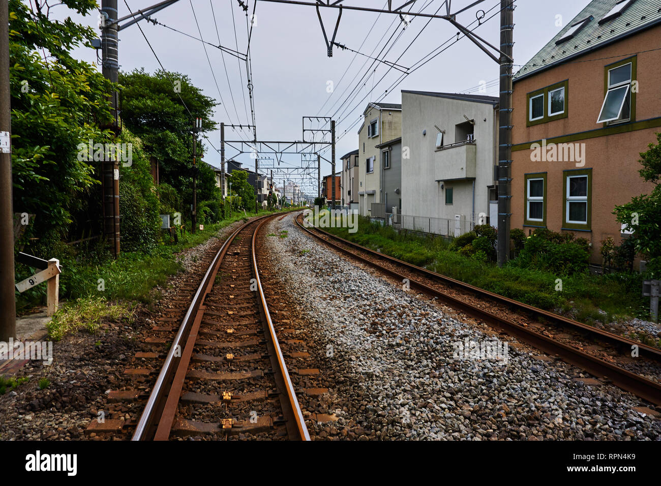 Railway railroad tracks winding through the small city of Takada ...