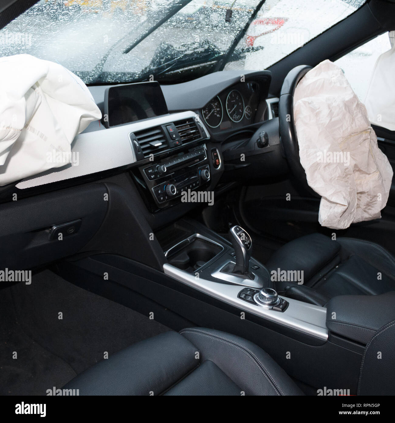 Car crash. Airbags deployed by a road traffic accident in the UK. Close ...