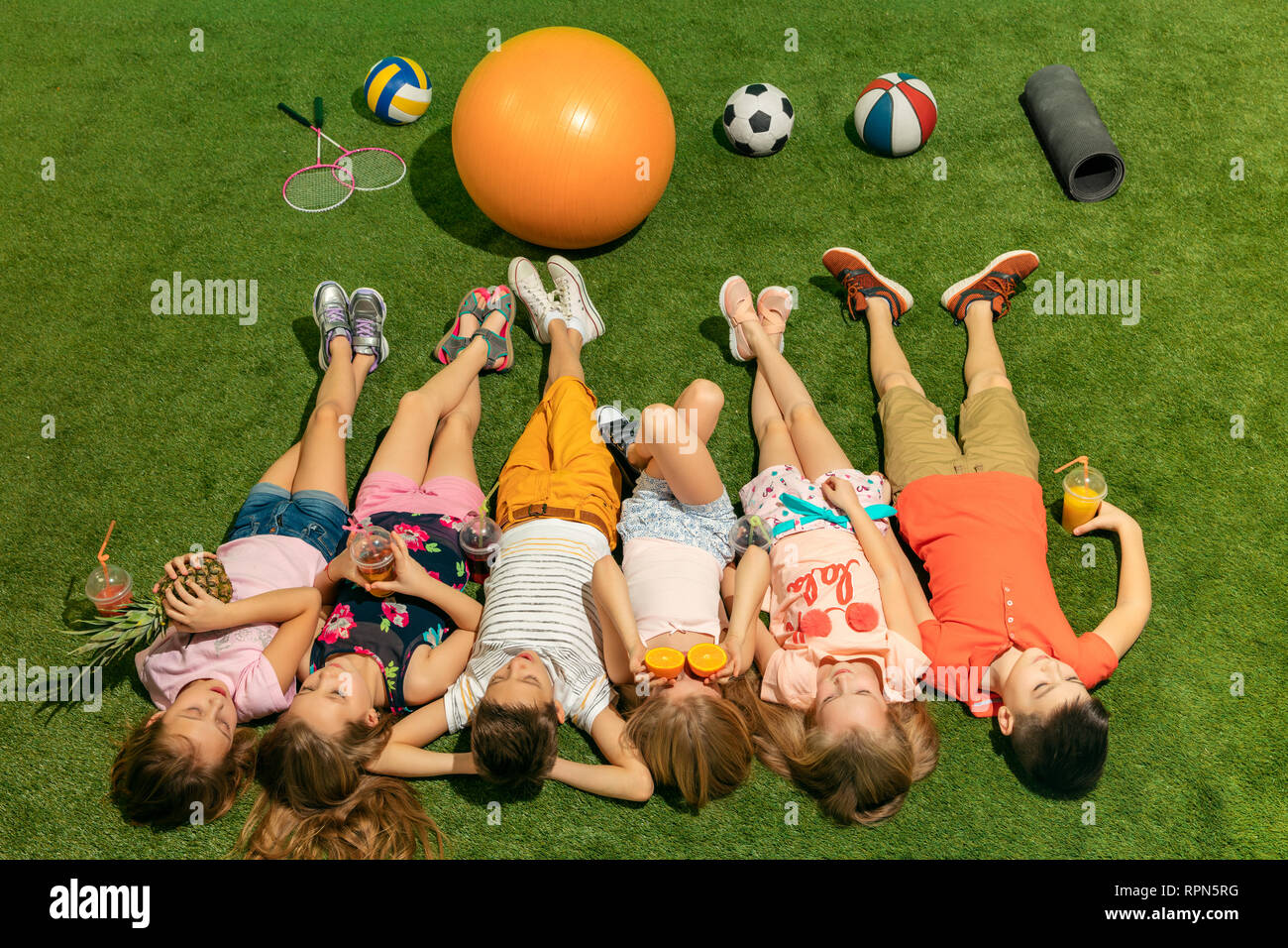 Group of happy children playing outdoors. Kids having fun in spring ...