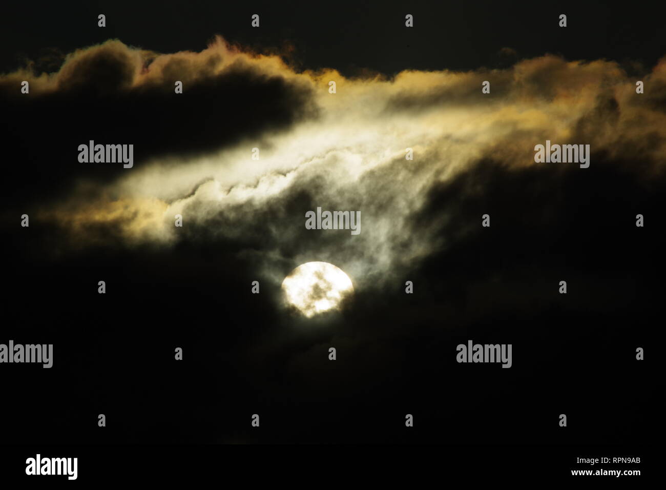 Spooky Natural Background of the Sun Shinning Through Thick Black Cloud ...