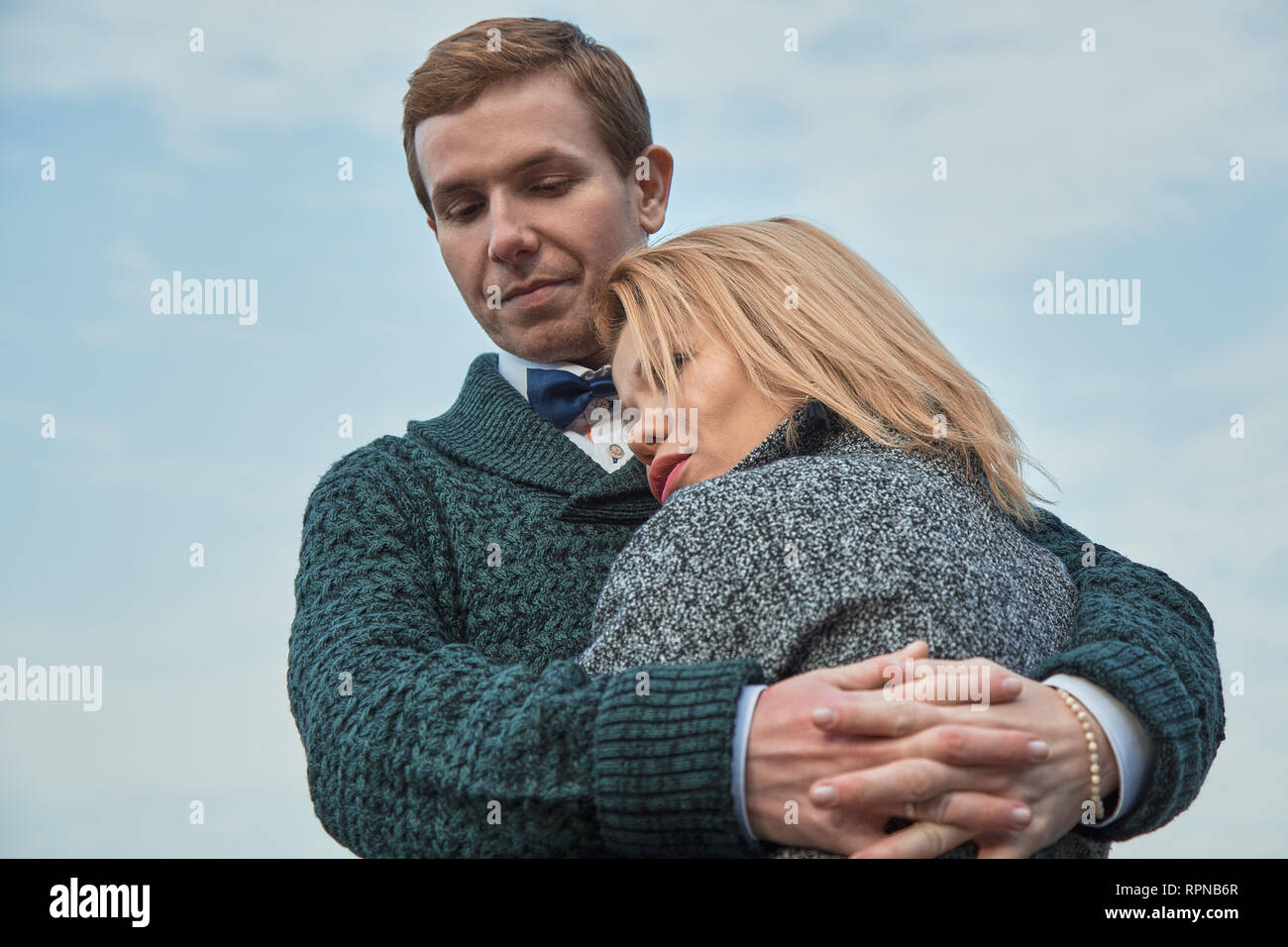 Romantic couple relaxing in autumn park, cuddling, kissing, enjoying ...