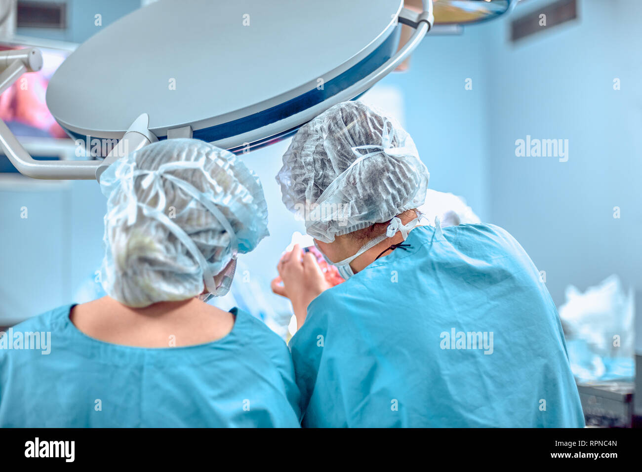 surgery, medicine and people concept - group of surgeons at operation ...