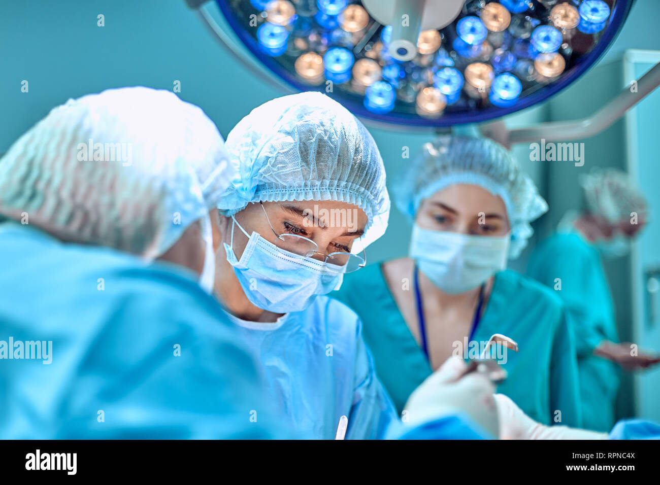 surgery, medicine and people concept - group of surgeons at operation ...
