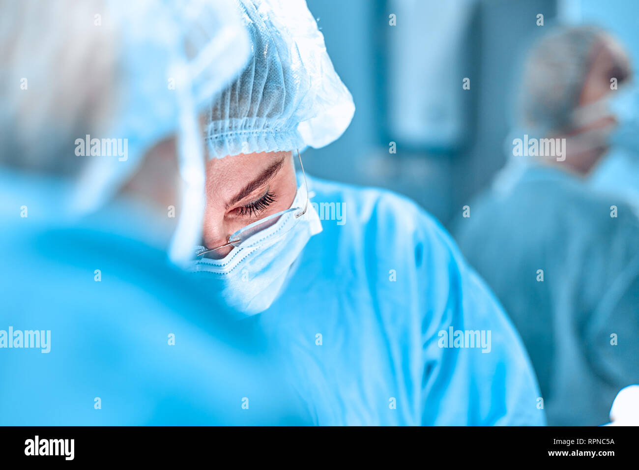 surgery, medicine and people concept - group of surgeons at operation ...