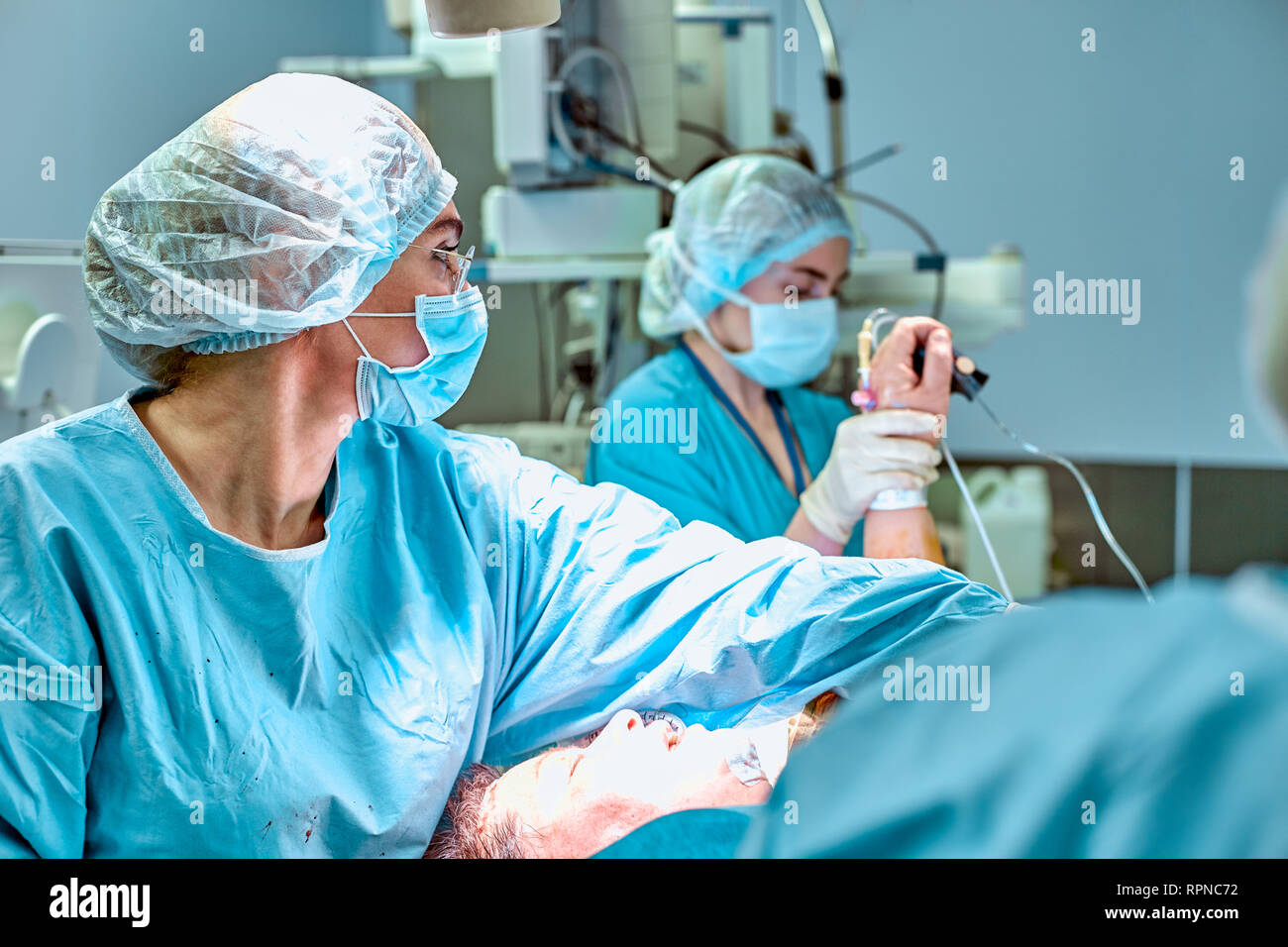 surgery, medicine and people concept - group of surgeons at operation ...