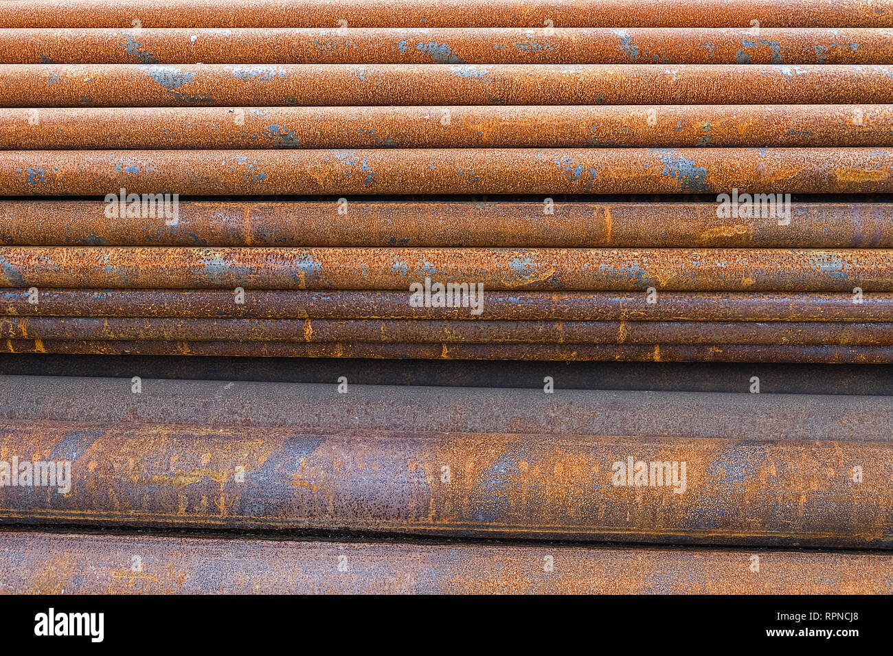 Rusted iron pipes horizontal Stock Photo - Alamy