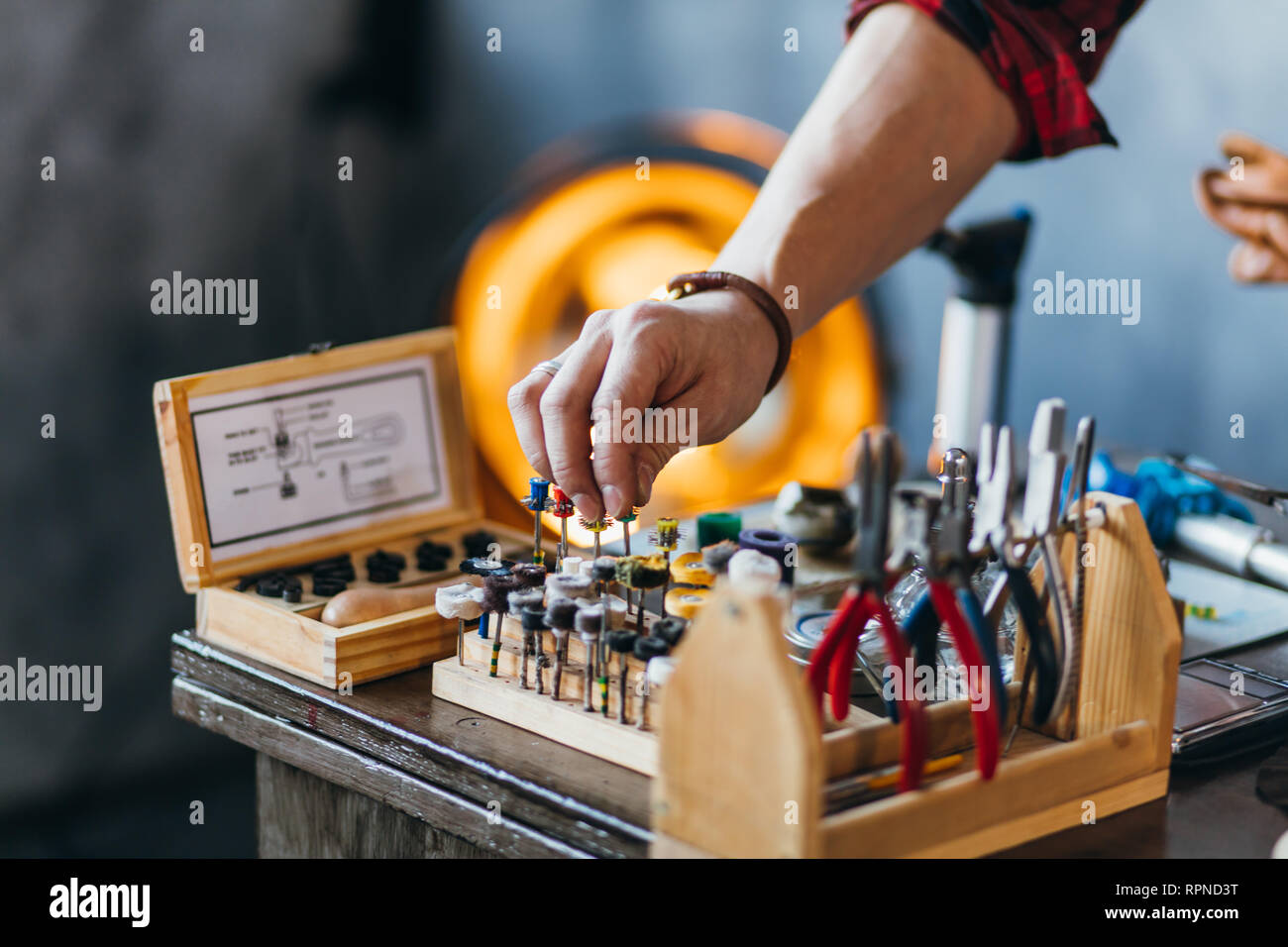 man holding polishing tools at workplace. close up cropped photo Stock ...