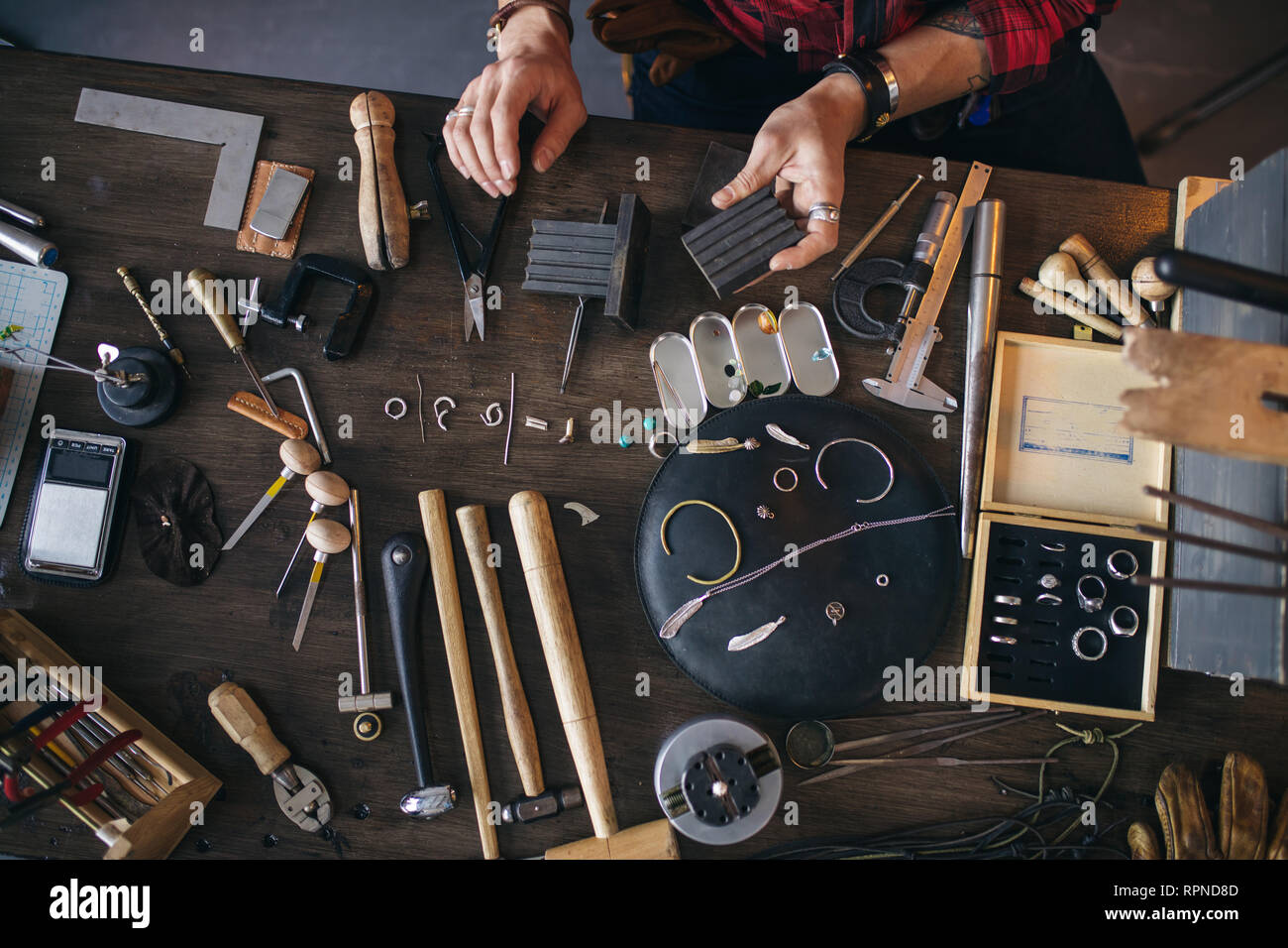 craftsman sharpening the necessary tool in the workshop Stock Photo - Alamy