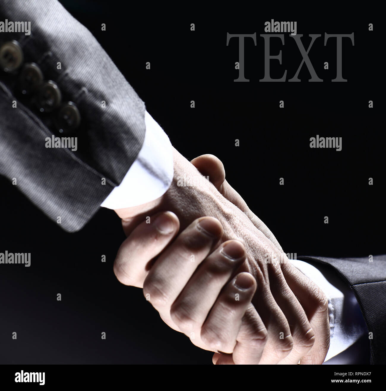 close up.business handshake isolated on black background.photo with ...