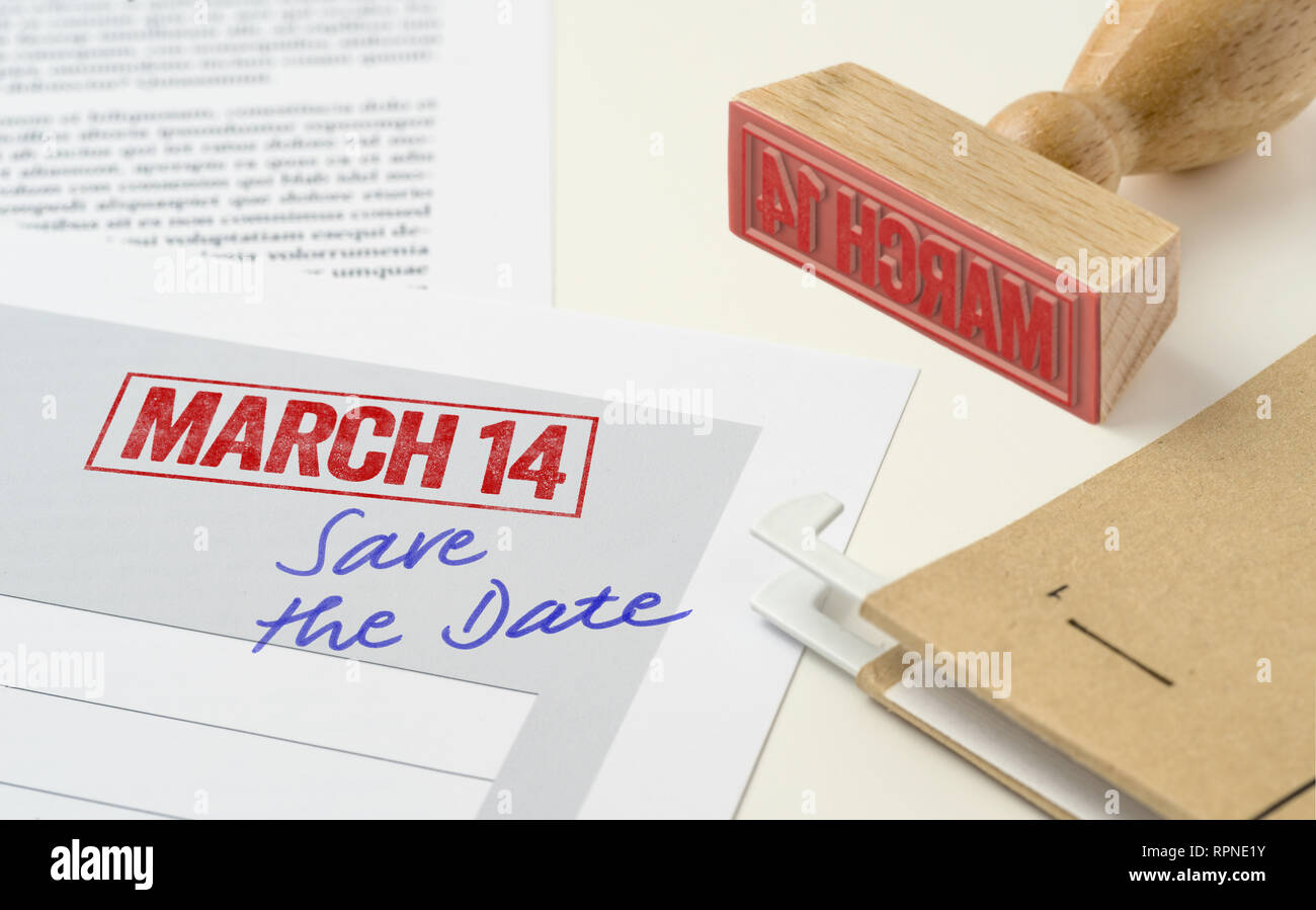 A red stamp on a document - March 14 Stock Photo - Alamy