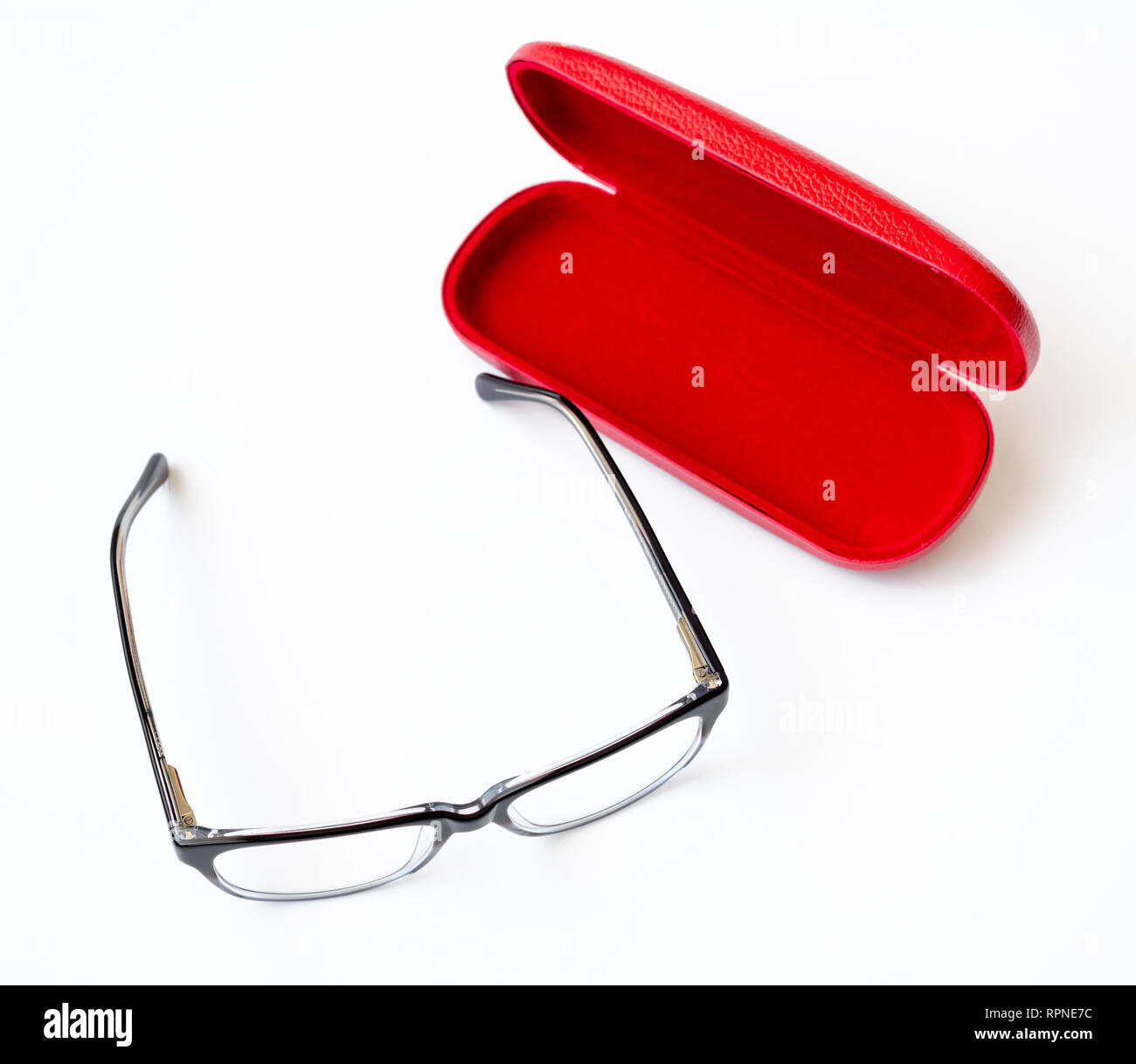 Glasses and red case on a white background Stock Photo - Alamy