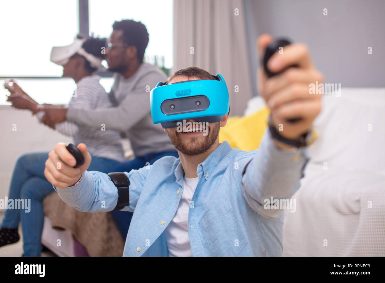 Cheerful caucasian guy feeling excitement and joy uexperiencing virtual ...