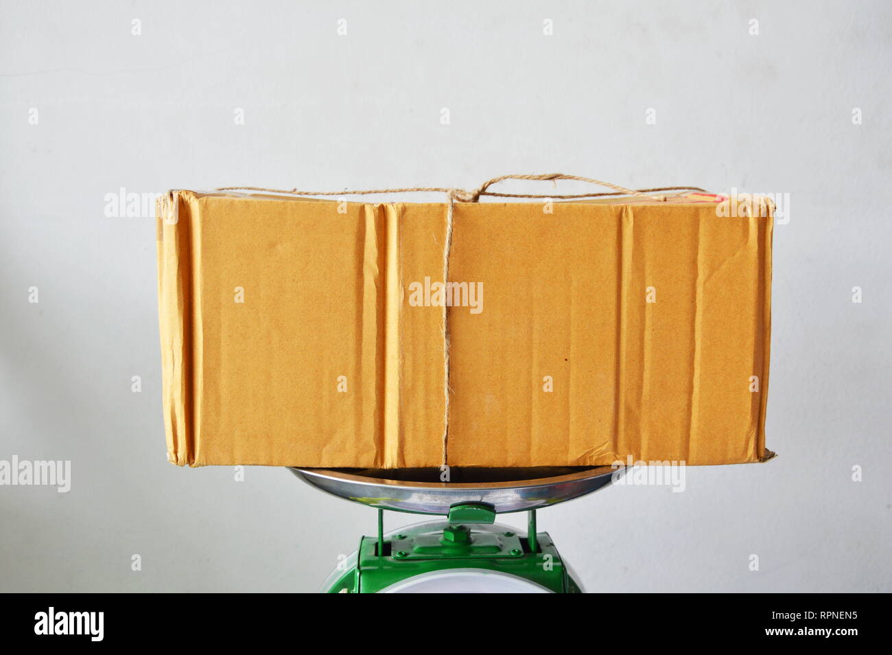 brown postbox on weighing scale tray in shop Stock Photo - Alamy