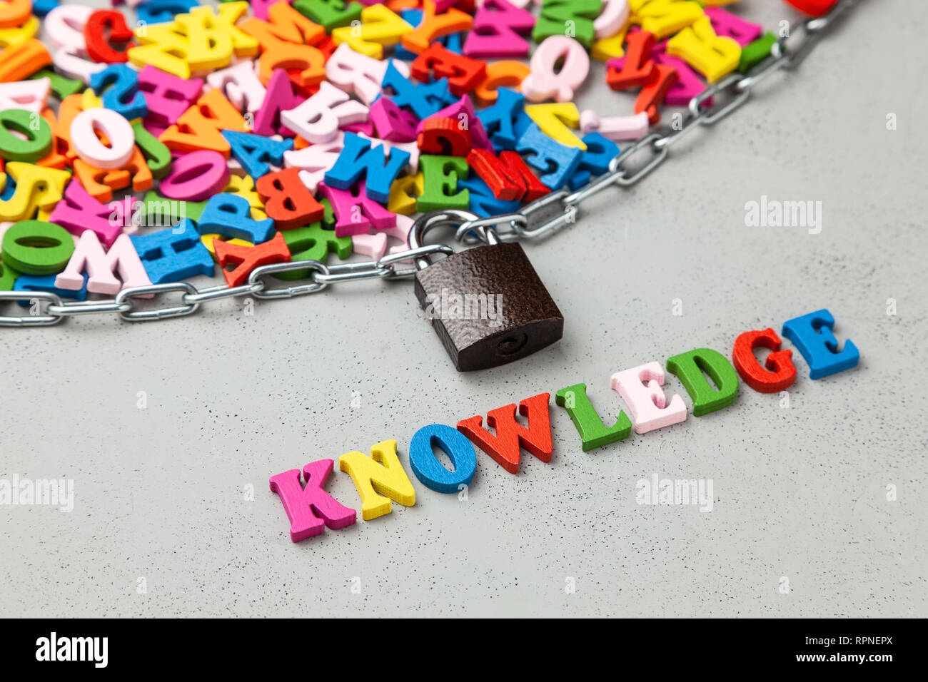 Closed secret knowledge. Letters of information symbol wrapped in chain ...