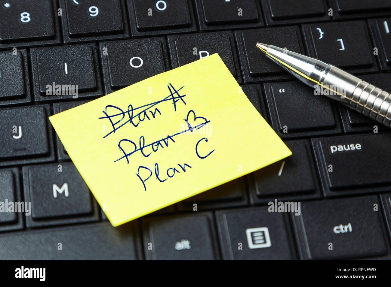 Office sticker with reminders on the laptop keyboard. Development Plan ...