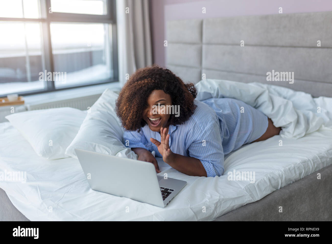 Joyful Plump Woman Talking Online With A Friend African Housewife Is A