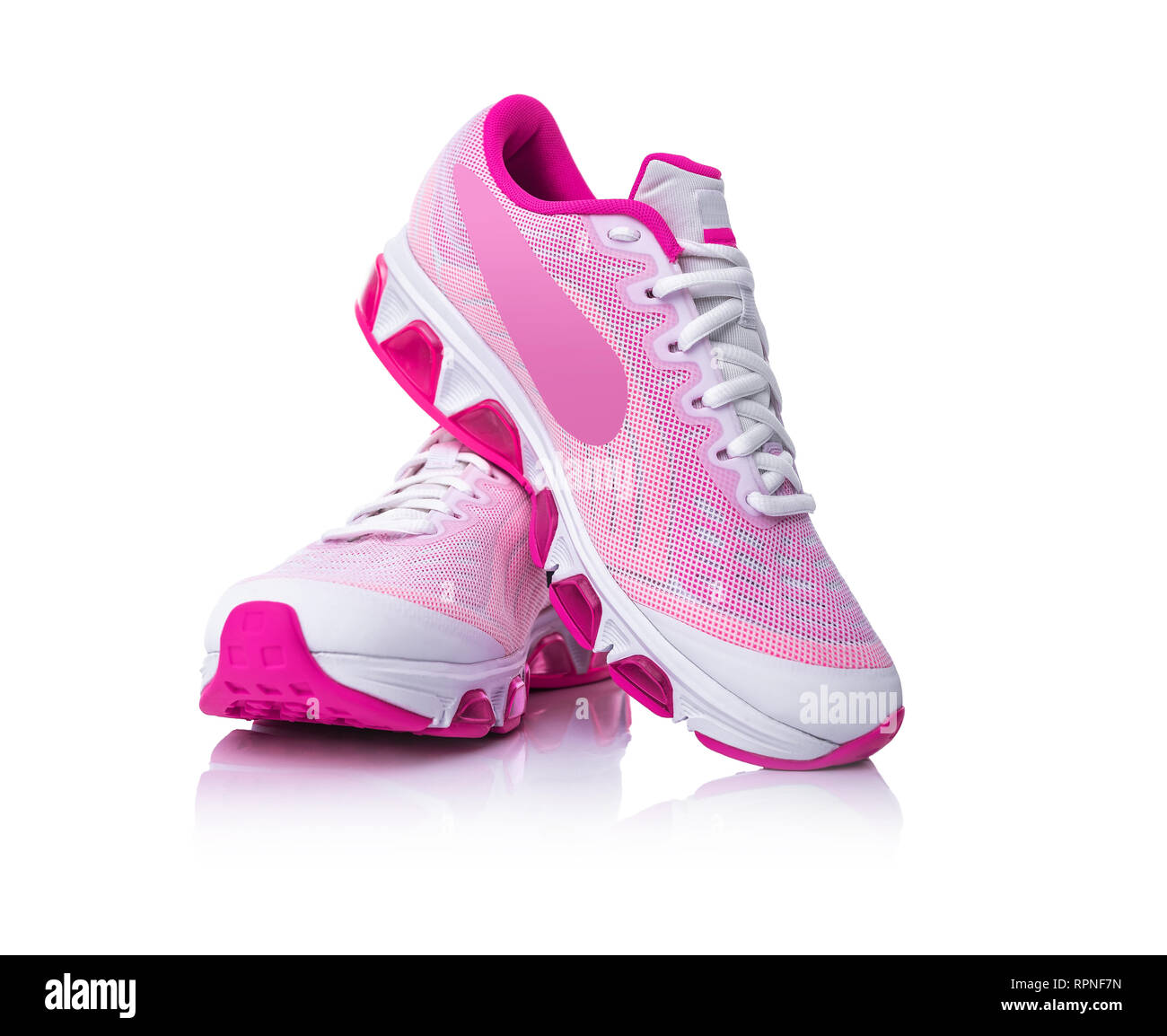Pink sport shoes on white background Stock Photo - Alamy